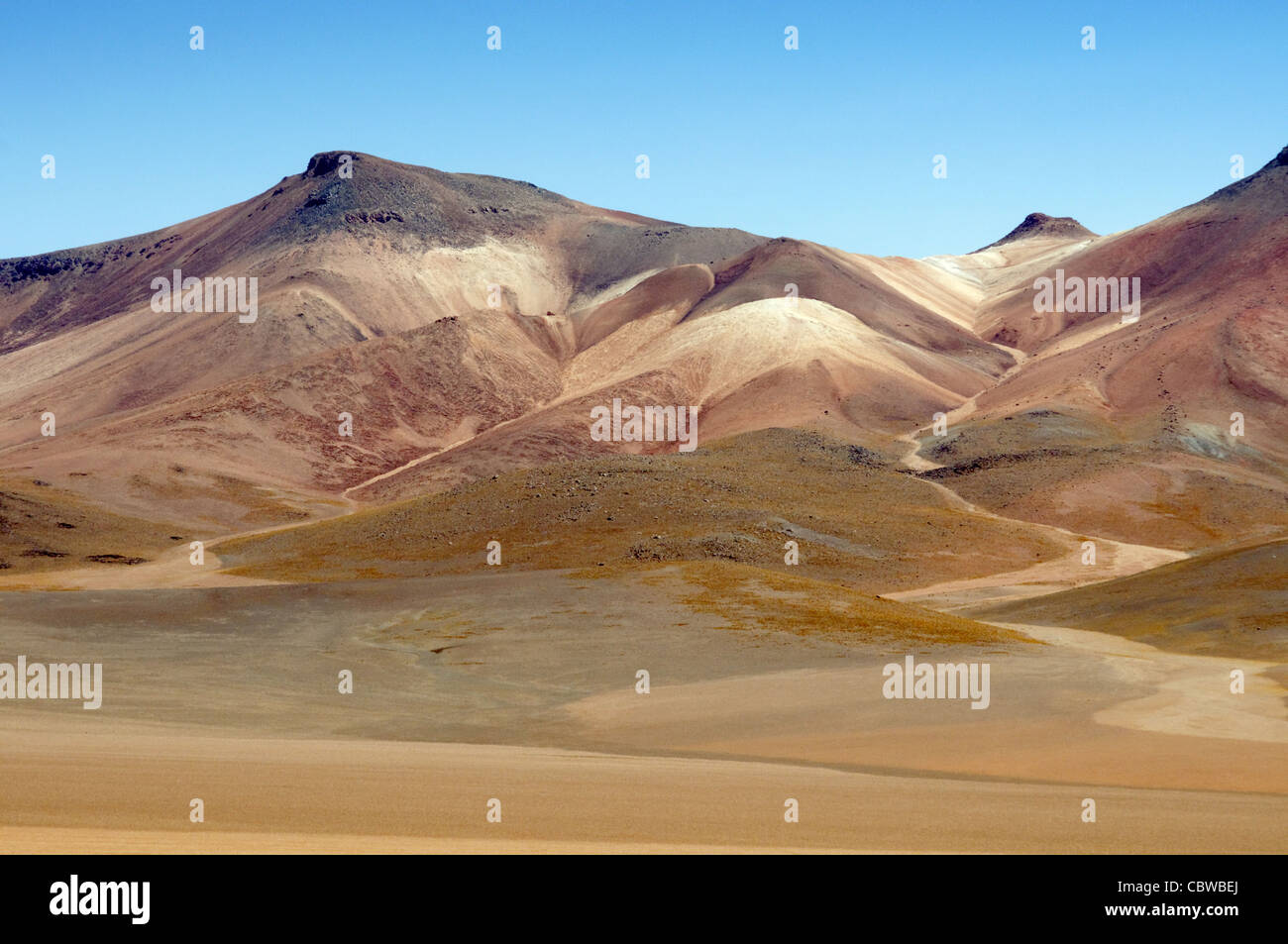 Brightly coloured layers of rock in the mountains of the Siloli desert ...