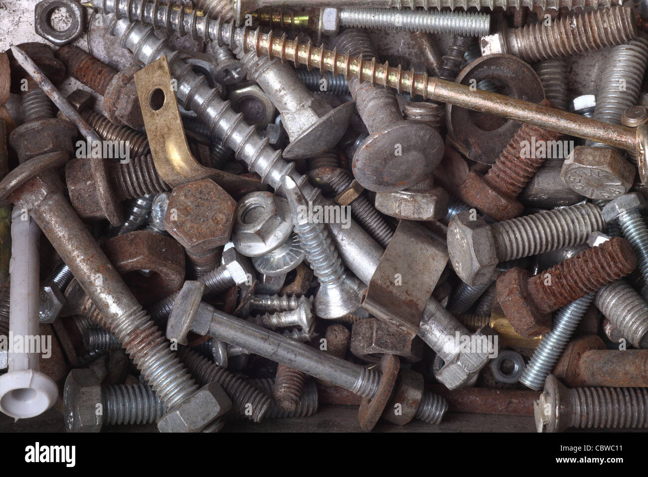 Industrial steel hardware bolts background Stock Photo - Alamy