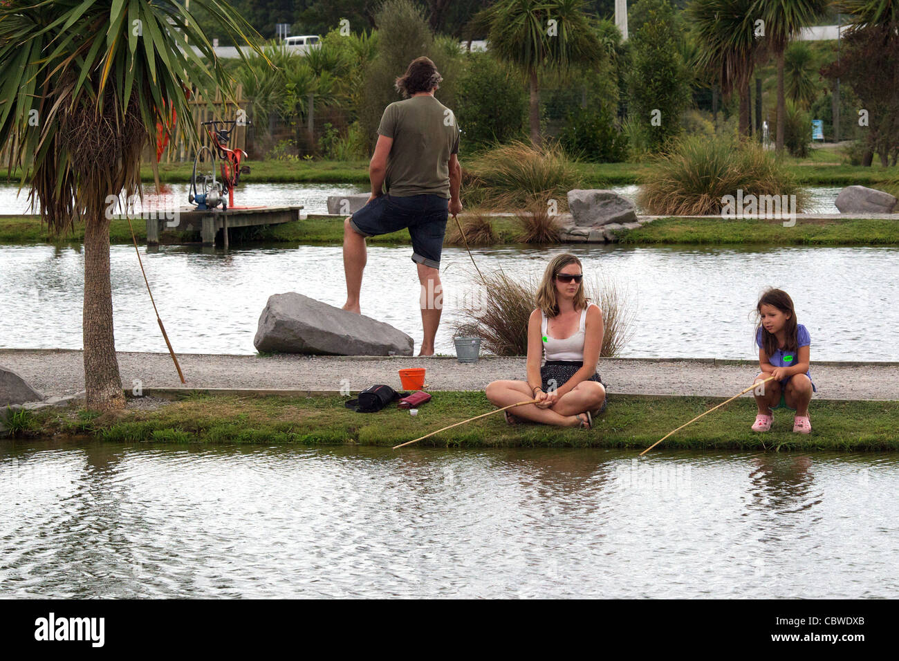 Youngsters fishing for prawns at the Huka Prawn Park, Taupo, New ...