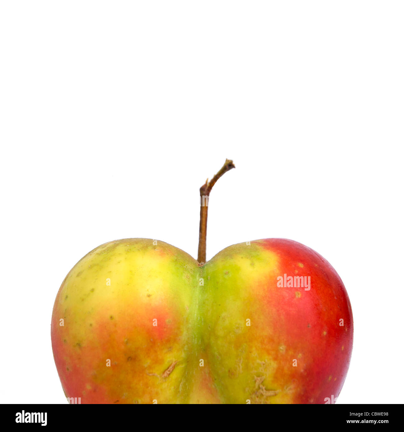 Two-colored apple with vibrant hues against a plain white background ...