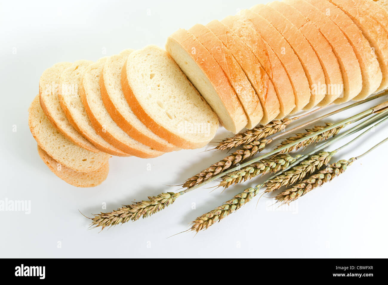 Bread and cereal ears on a white background Stock Photo - Alamy