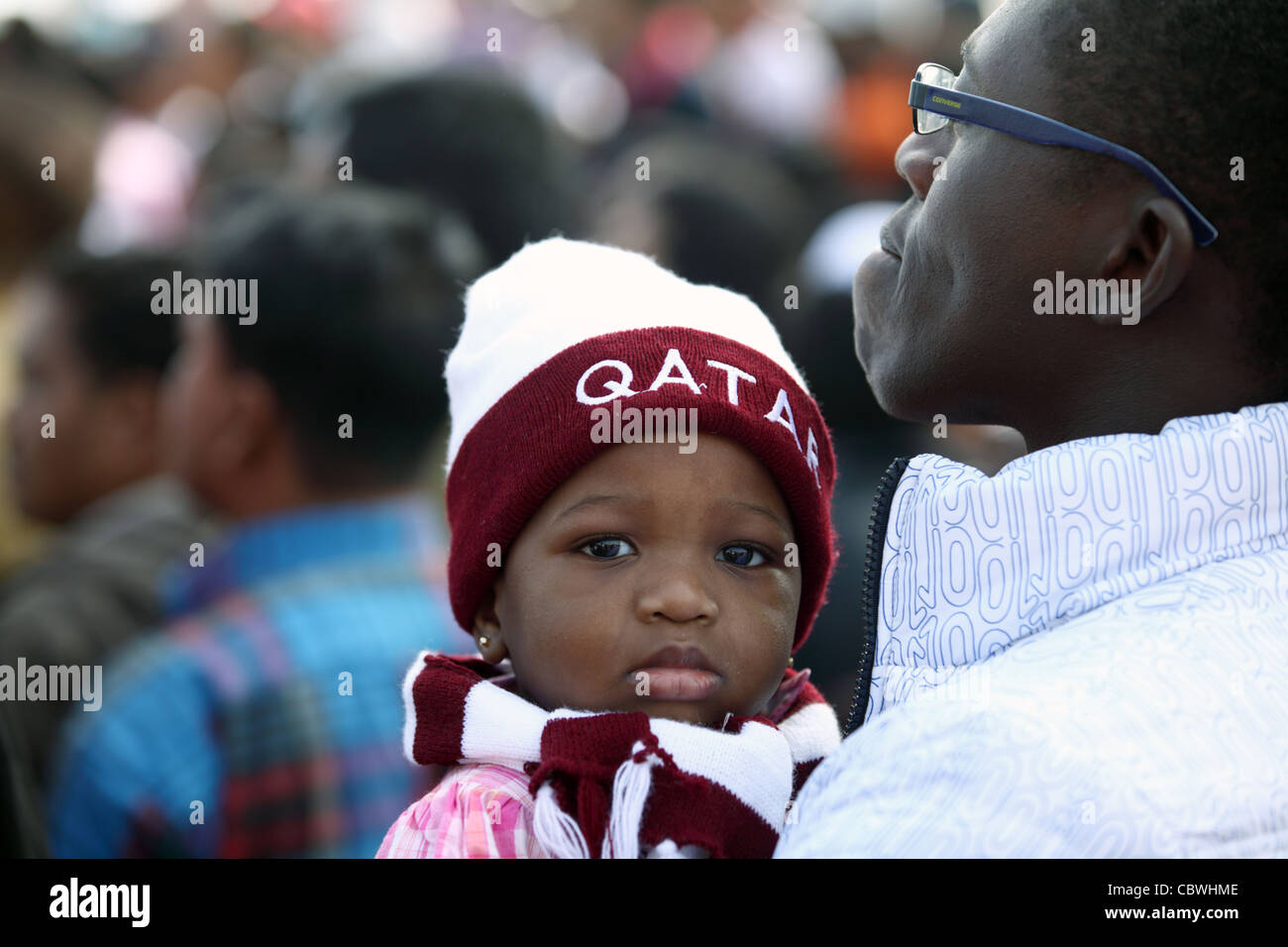 A young child wears a Qatar hat at the Arab state's National Day ...