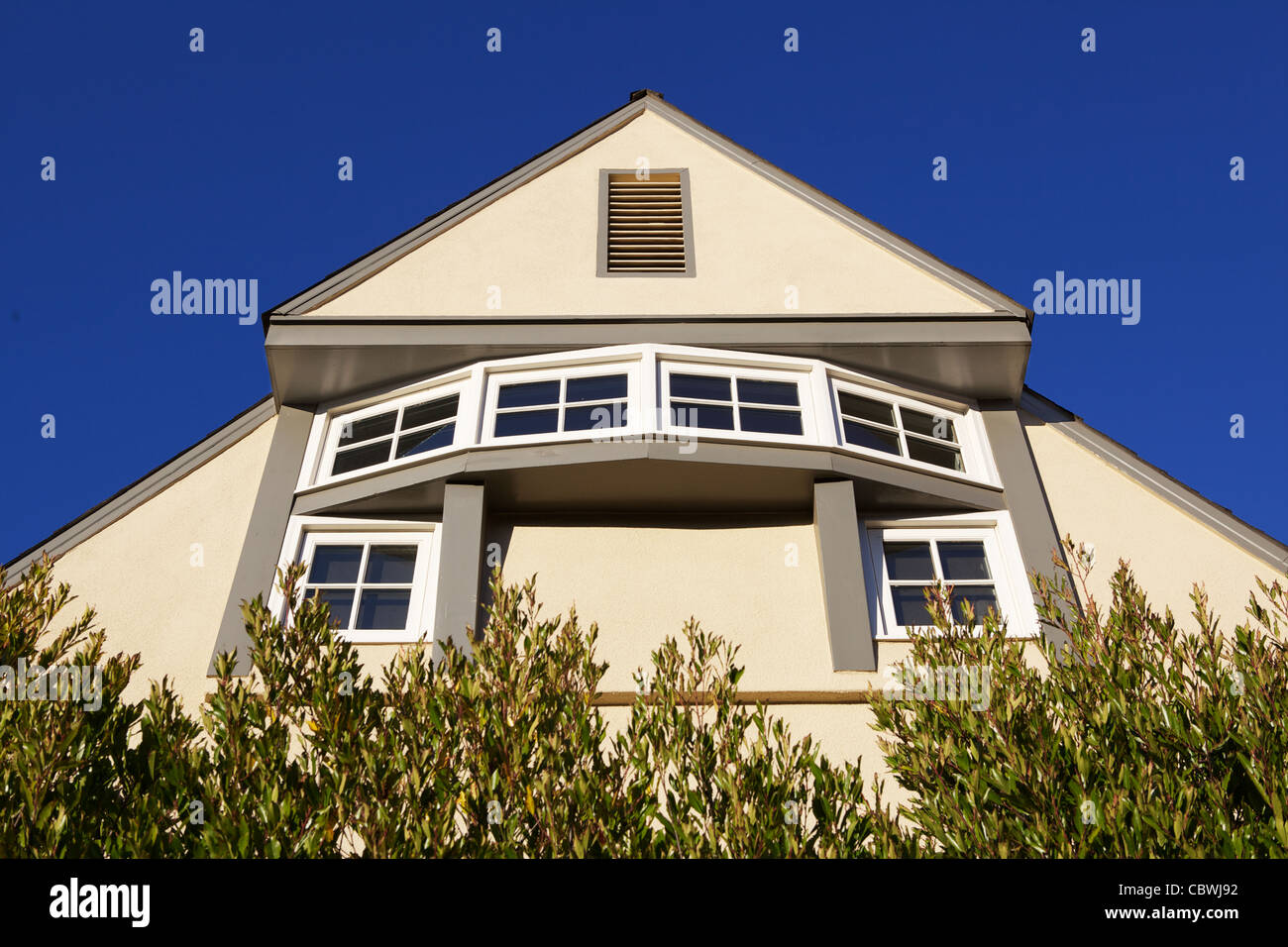 Unique Home windows that resemble old ship windows against a bright ...