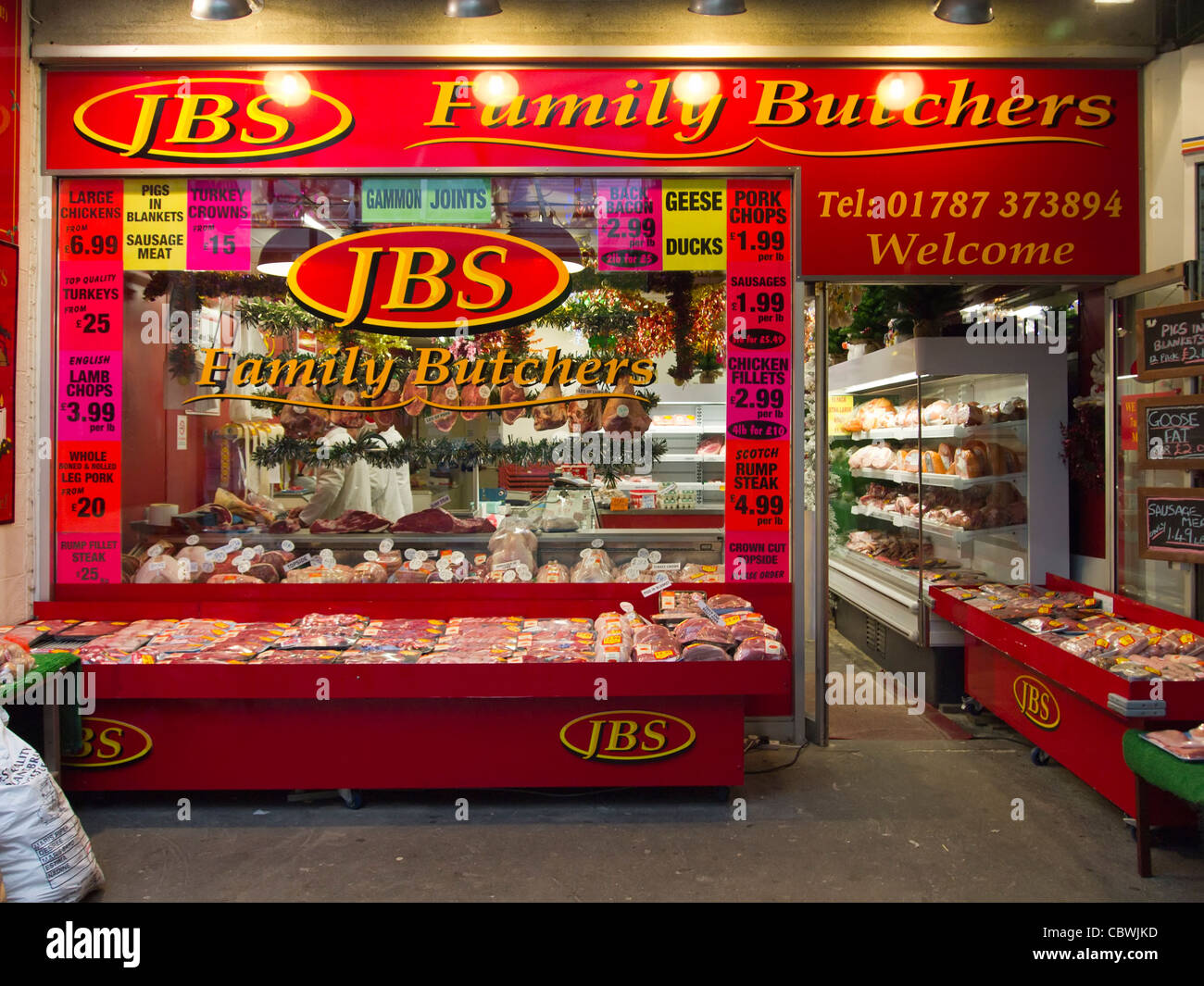 A traditional family-run butcher's shop, with its meat displays, in ...