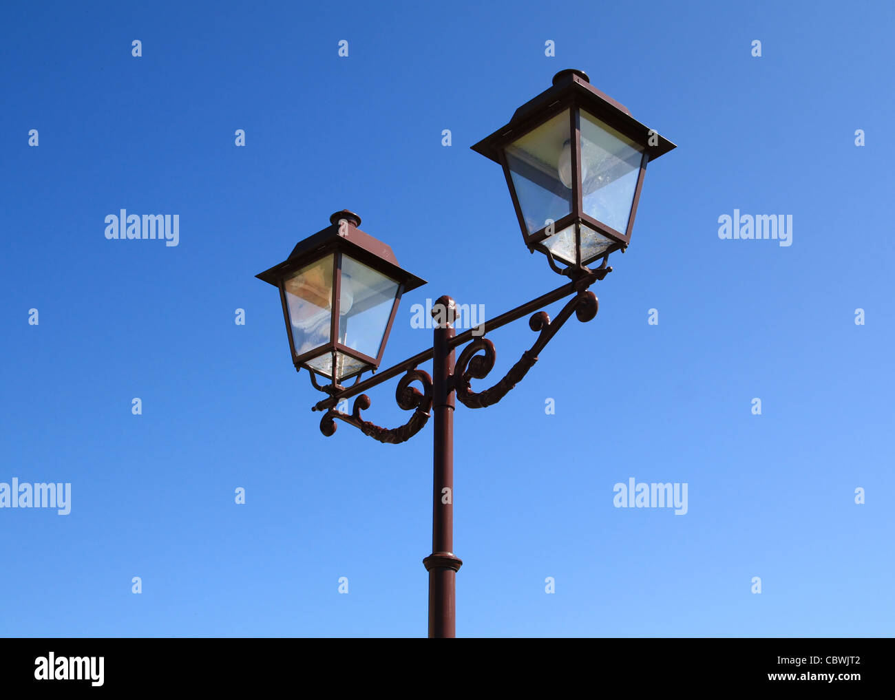 old torch on blue background Stock Photo - Alamy
