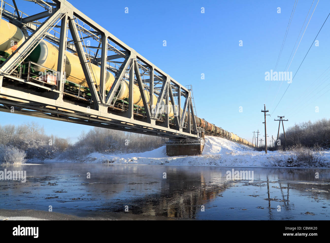 train on bridge through river Stock Photo - Alamy