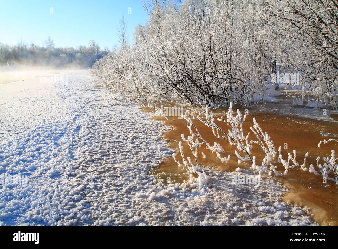 river water in snow bush Stock Photo - Alamy