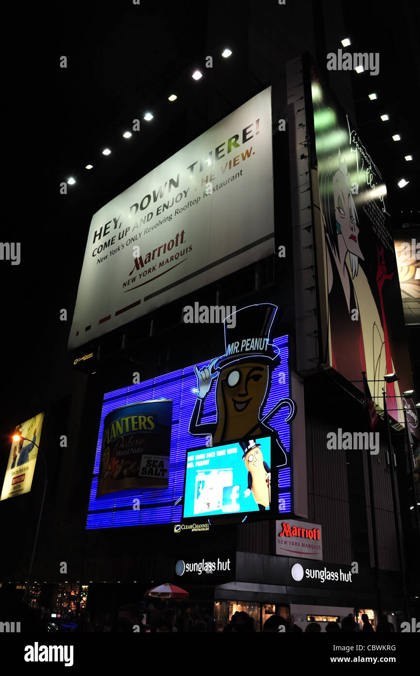 Night neon portrait 'Mr Peanut' billboard, building facade, corner West ...