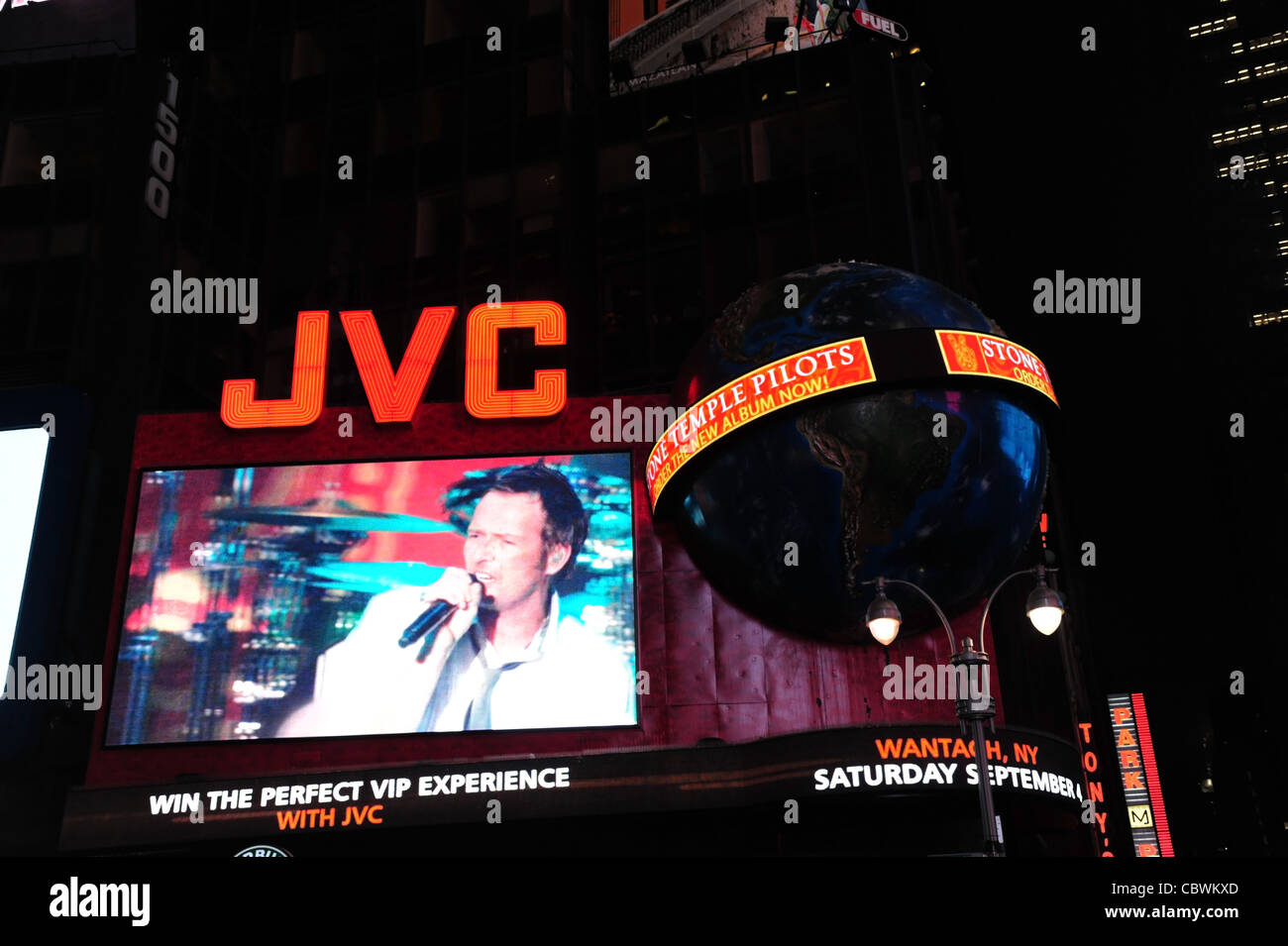 Building 1 night time facade red neon jvc name hi-res stock photography ...