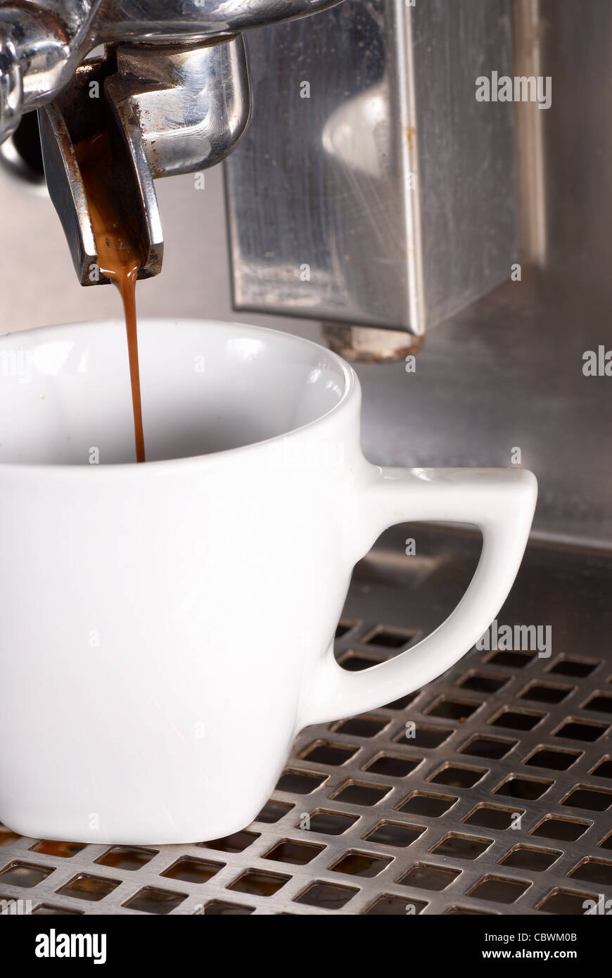 Preparing a strong black coffee with a professional machine Stock Photo ...