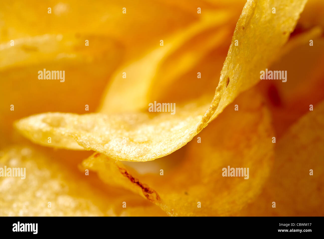 Close up take of fried potato crisps Stock Photo - Alamy