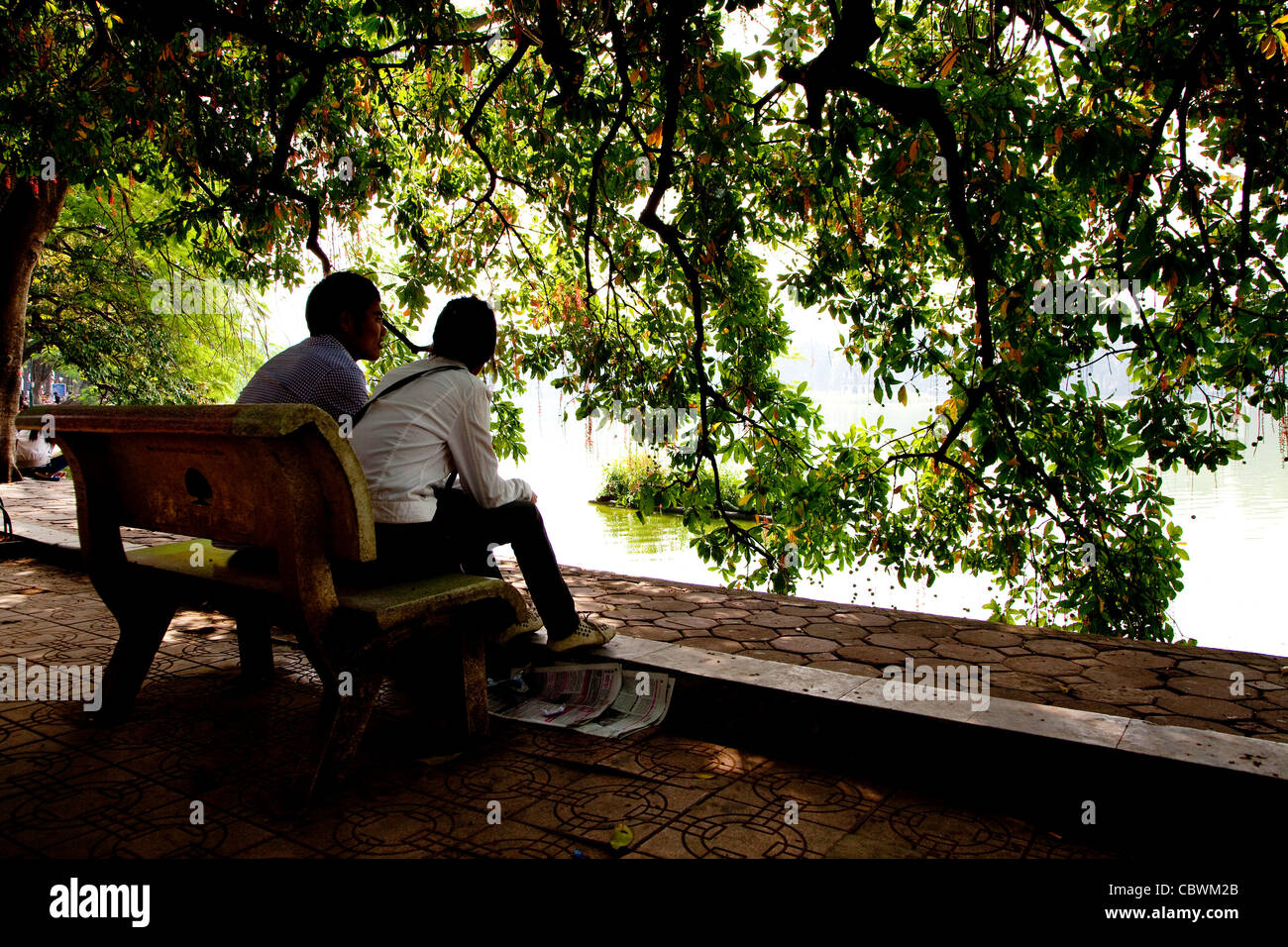 Lovers sitting on a bench, Hanoi, Vietnam, Asia Stock Photo - Alamy