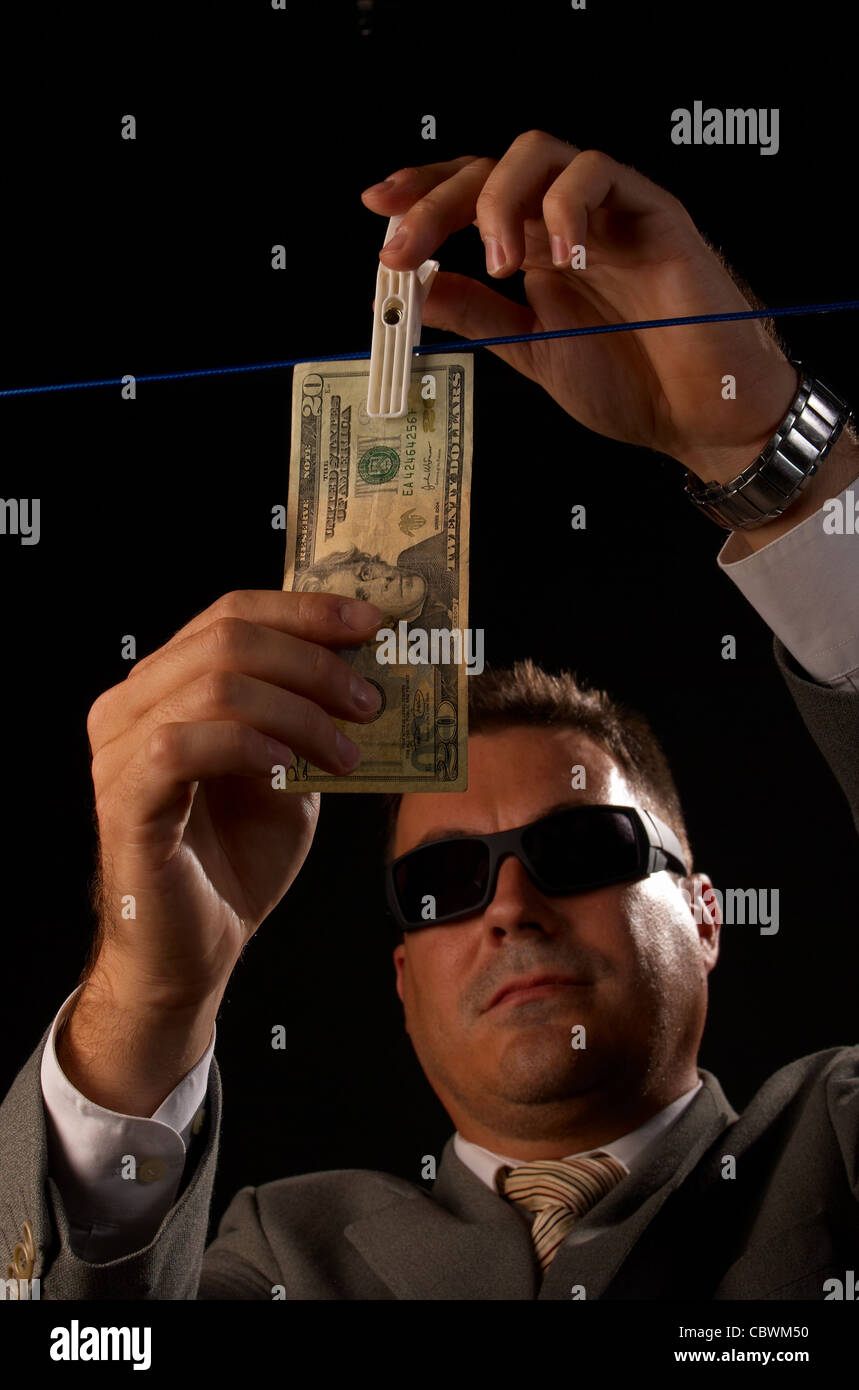 Mafia guy busy doing some serious money laundering Stock Photo - Alamy