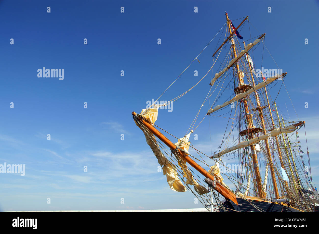 Old ship yard arm square rigging. Sailing ship's furled canvas sails ...
