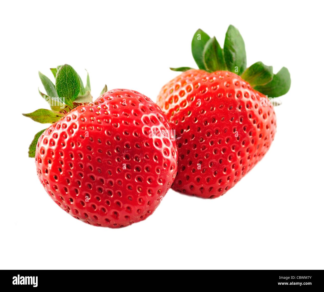 two strawberries on white background Stock Photo - Alamy