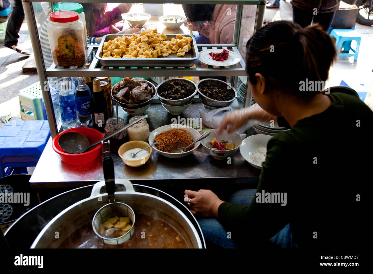 Traditional small restaurant with typical Vietnamese food, Hanoi ...