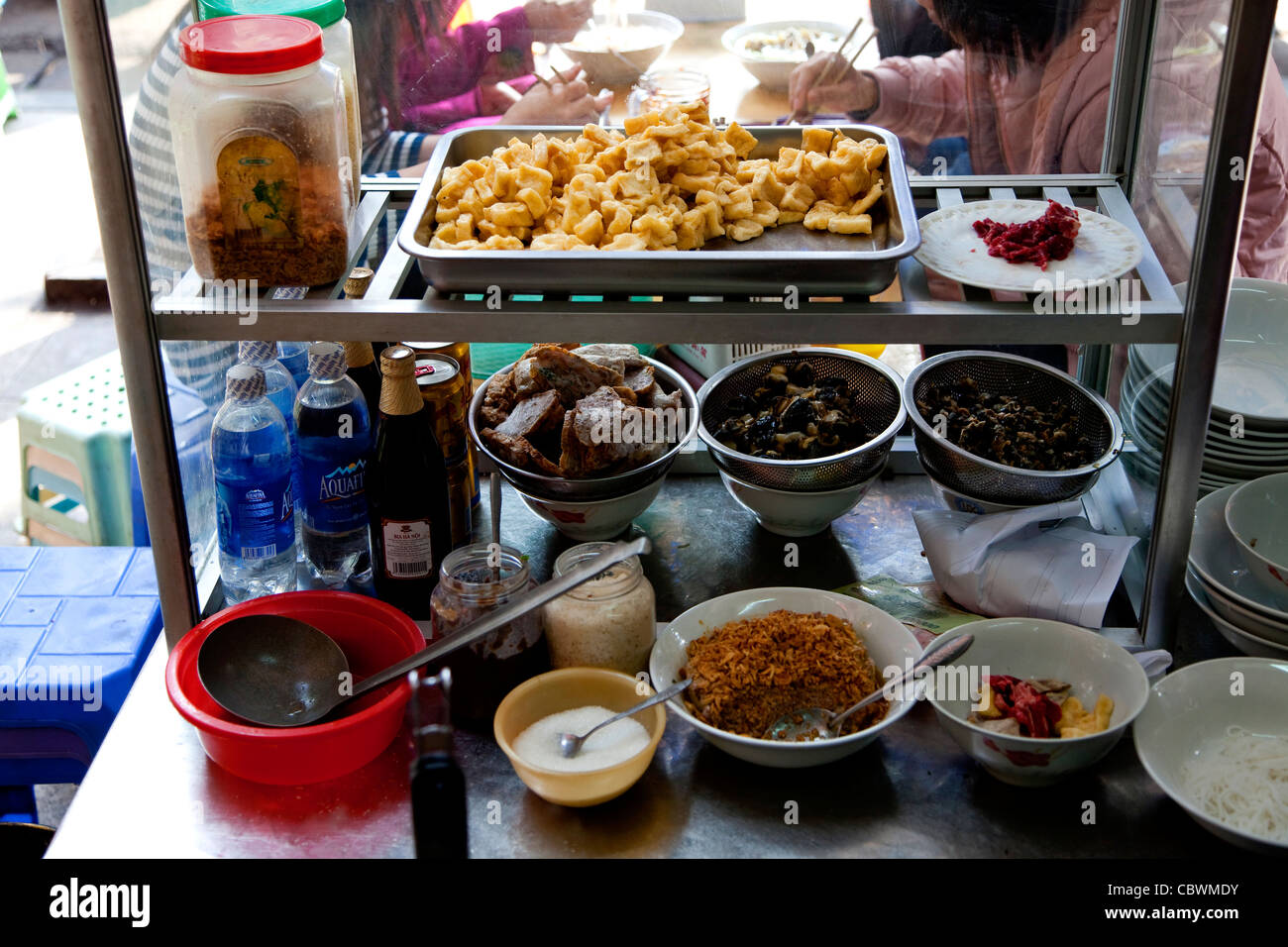 Traditional small restaurant with typical Vietnamese food, Hanoi ...