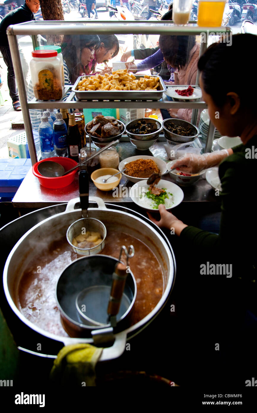 Traditional small restaurant with typical Vietnamese food, Hanoi ...