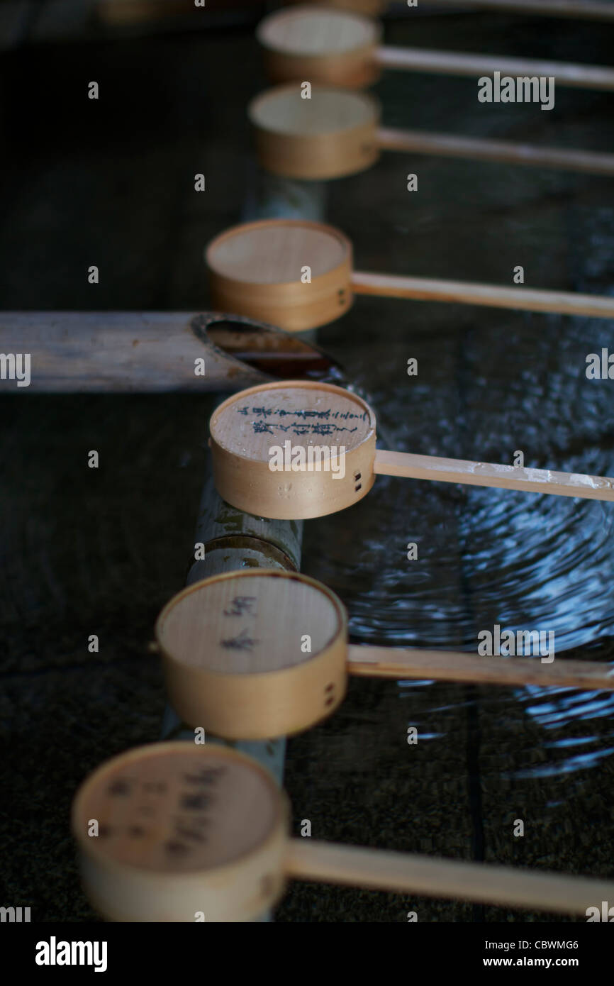 bamboo ladles on the top of the Zenkō-ji temple tsukubai Stock Photo ...