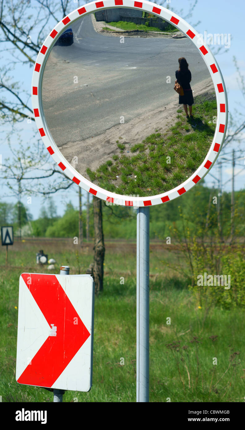 Mirror for security and traffic safety, mirror reflecting woman Stock ...