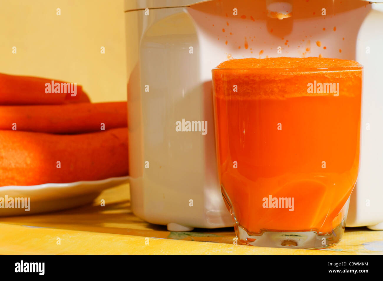 Carrot Juice in Glass, juice extractor, juicer Stock Photo - Alamy
