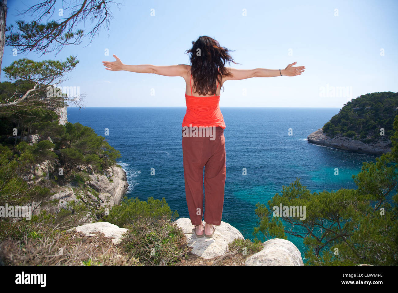 Woman on top at Menorca island in Spain Stock Photo - Alamy