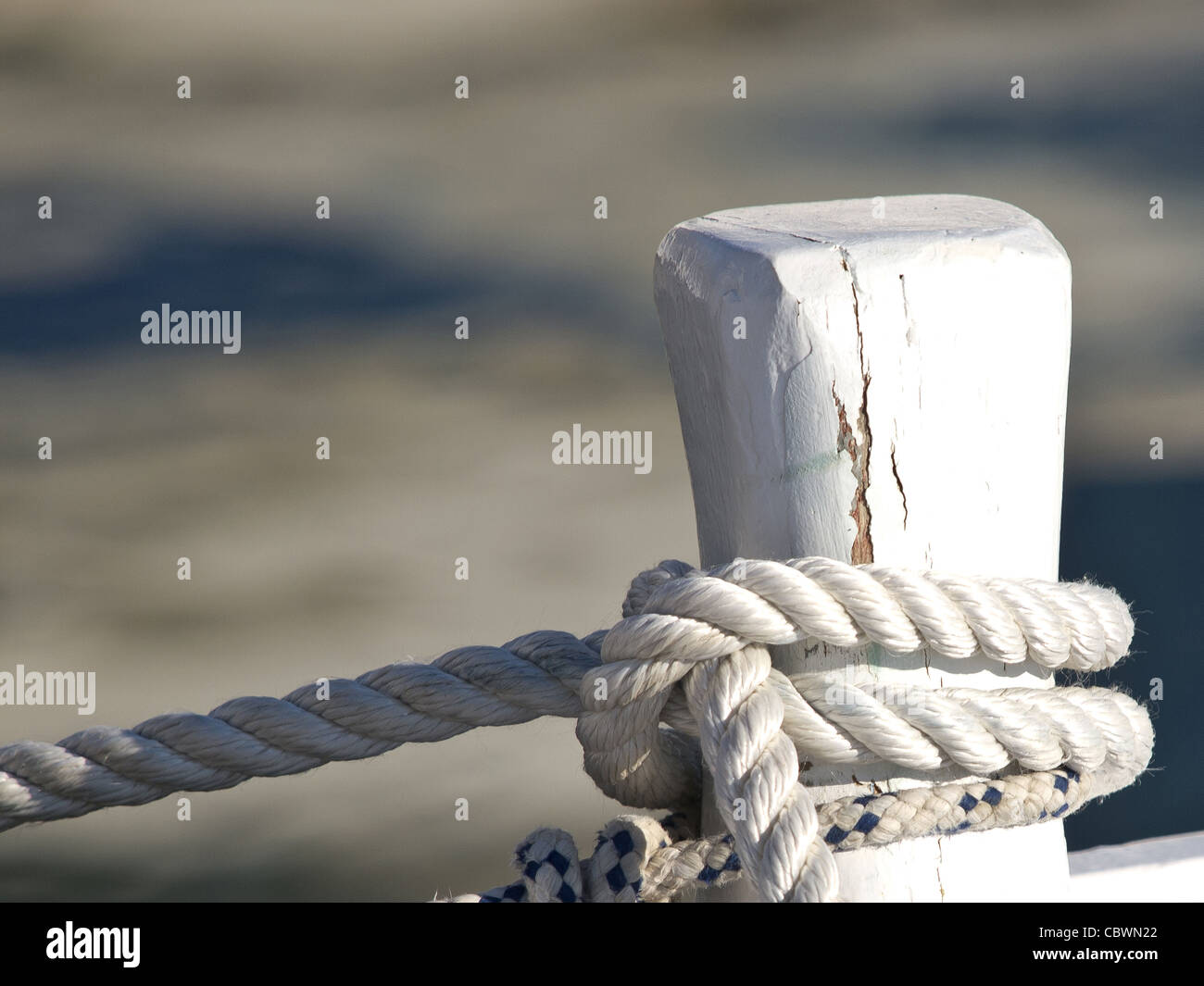 ropes on the boat docked in the harbour Stock Photo - Alamy