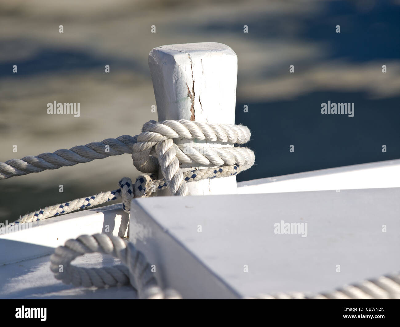ropes on the boat docked in the harbour Stock Photo - Alamy
