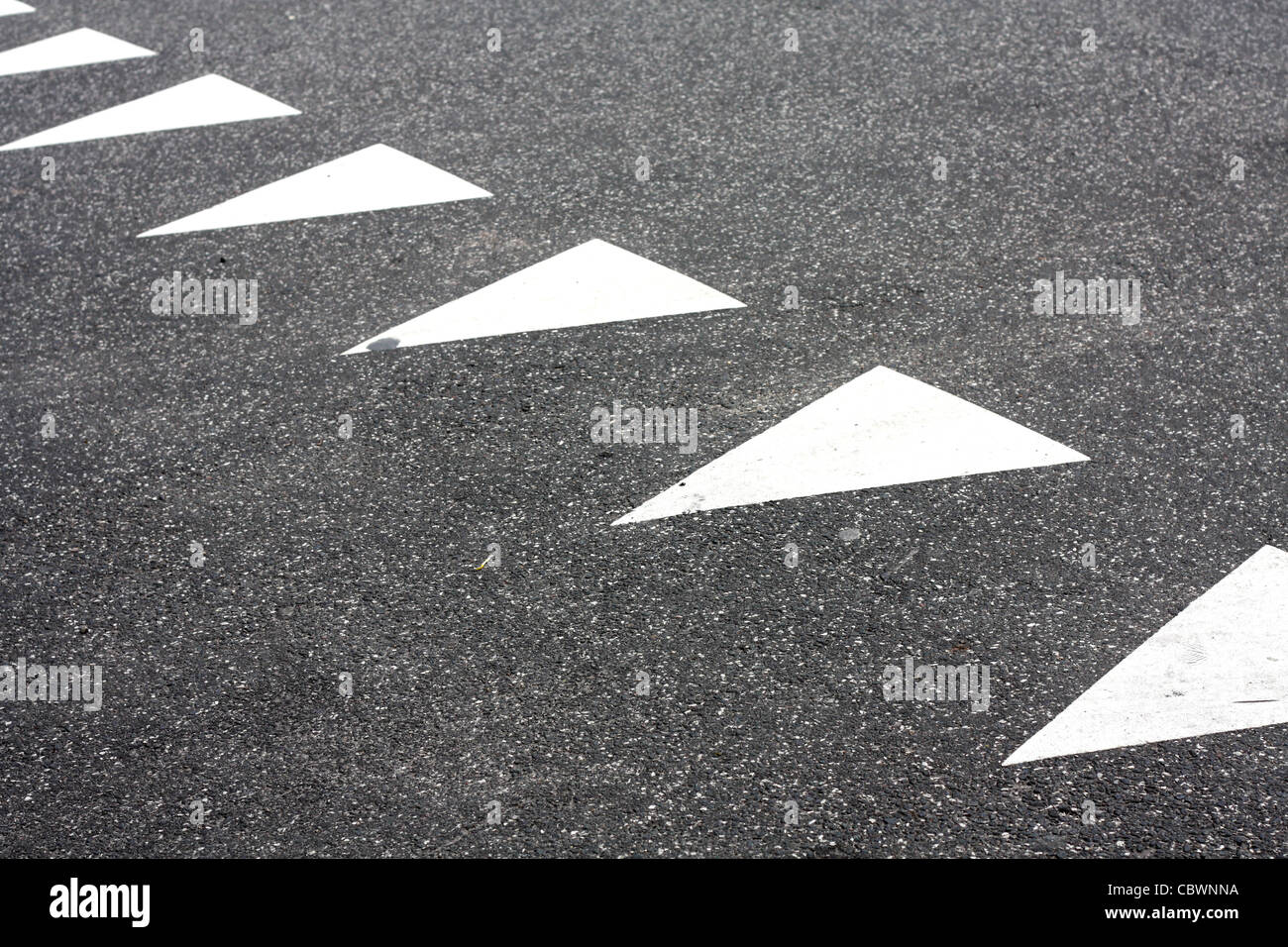 Triangular markings on a road Stock Photo - Alamy