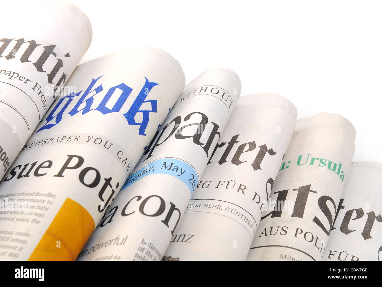 Various international newspapers on white background Stock Photo - Alamy