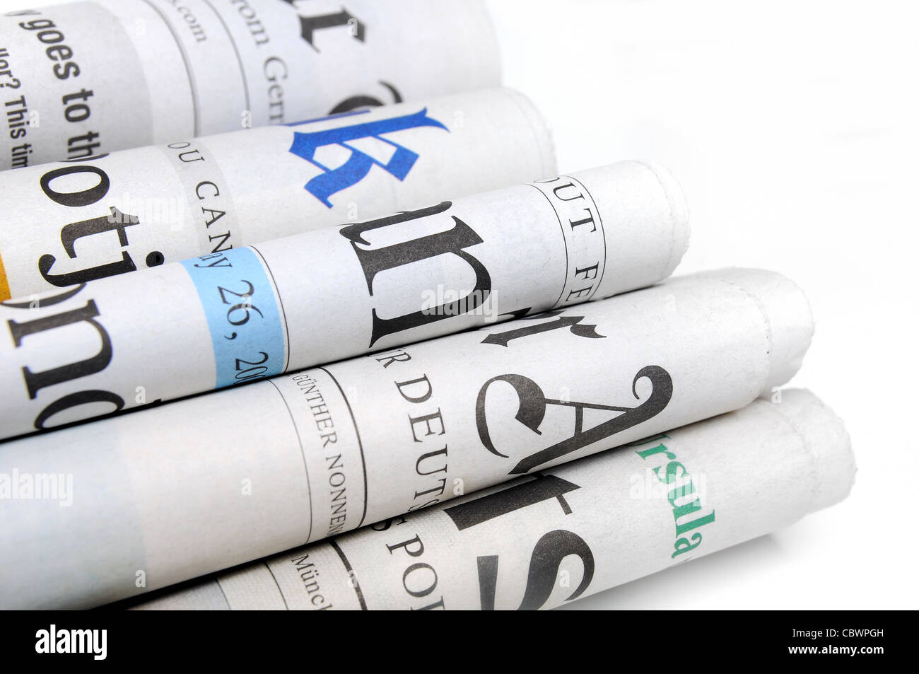 Various international newspapers on white background Stock Photo - Alamy