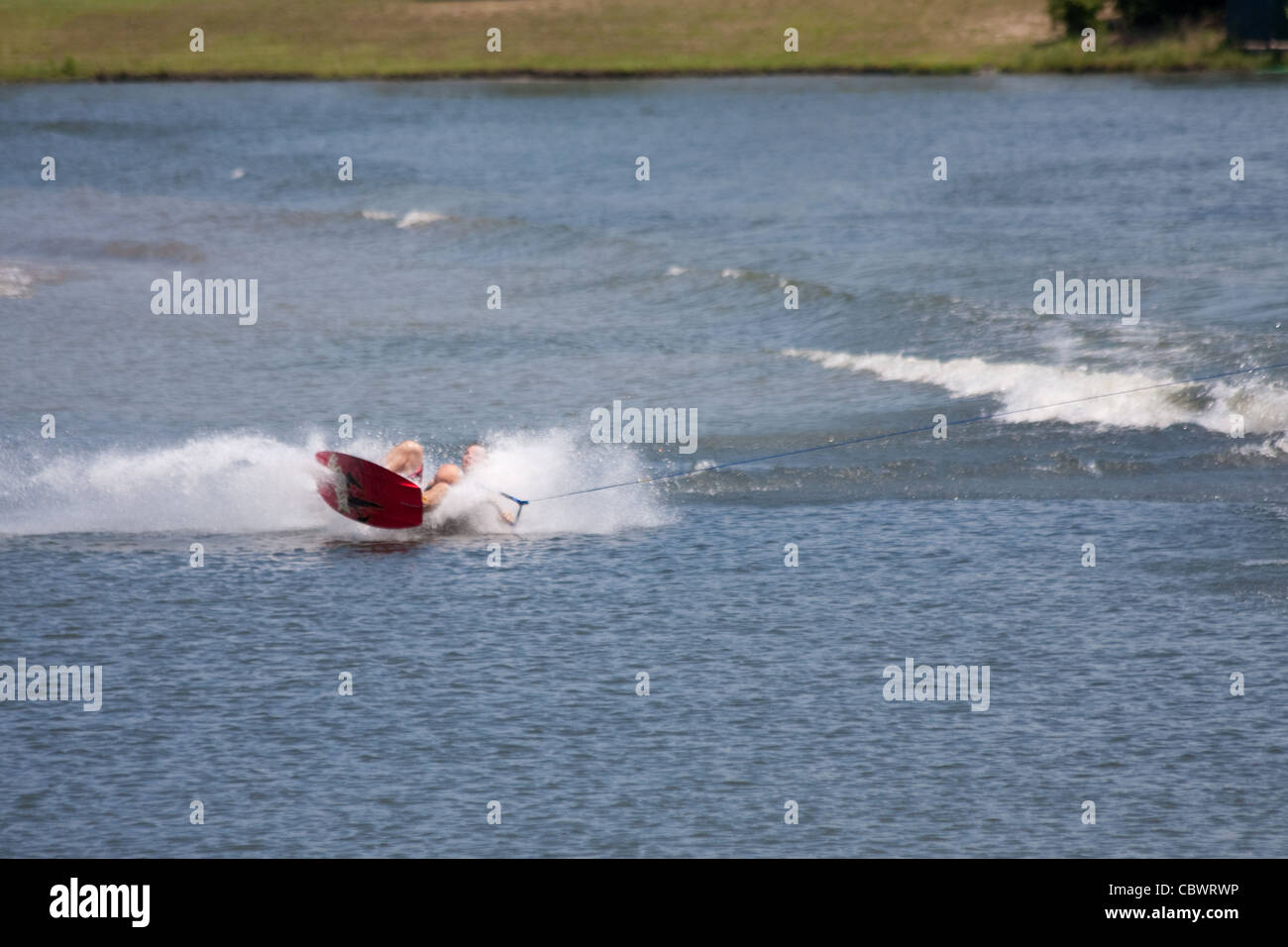 Man jumping the wake, stunts on a wakeboard, extreme sport Stock Photo ...