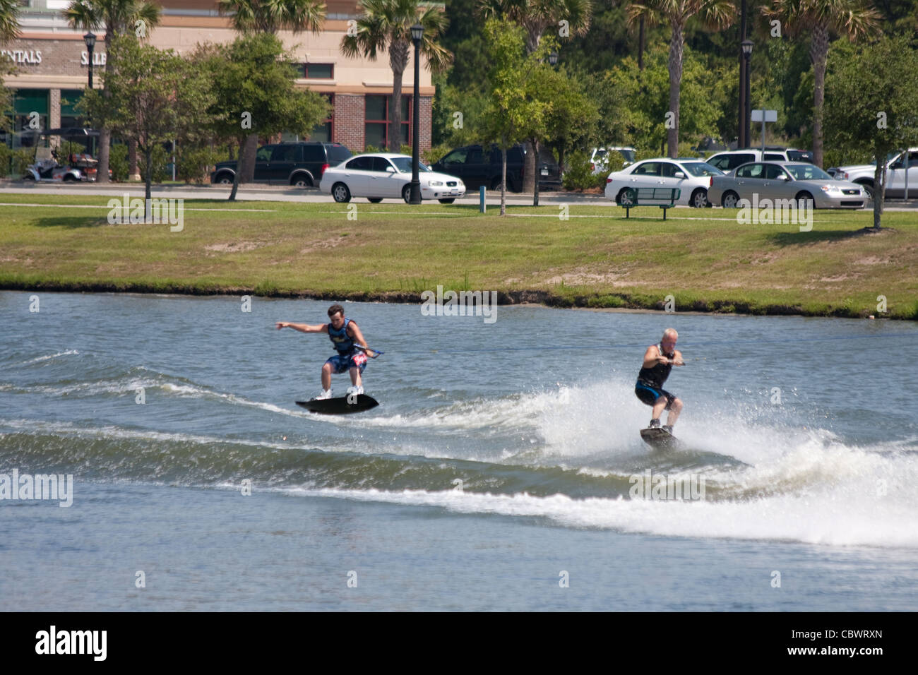 Two men doing stunts on a wakeboard, extreme sport Stock Photo - Alamy