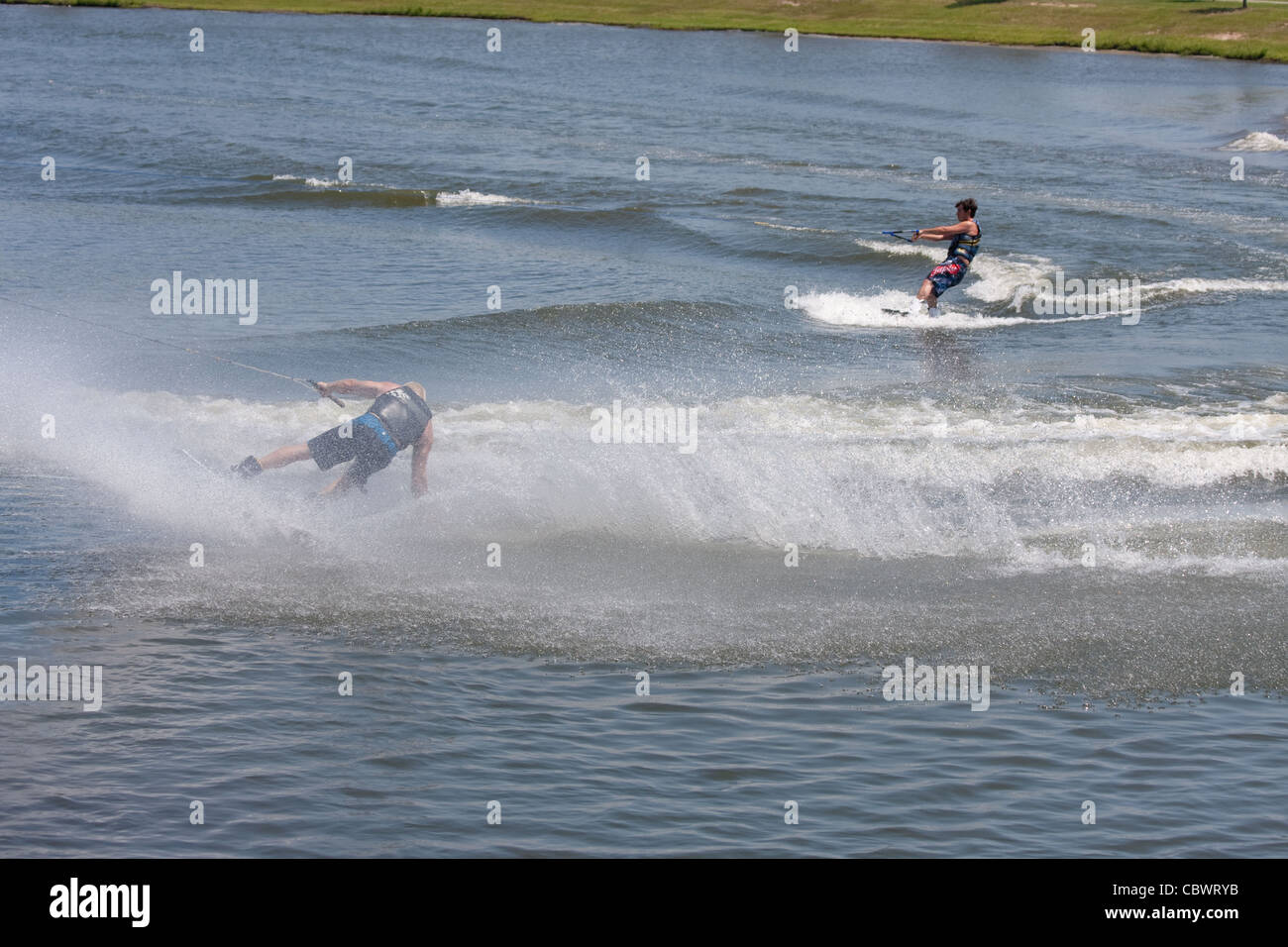 Two men doing stunts on a wakeboard, extreme sport Stock Photo - Alamy