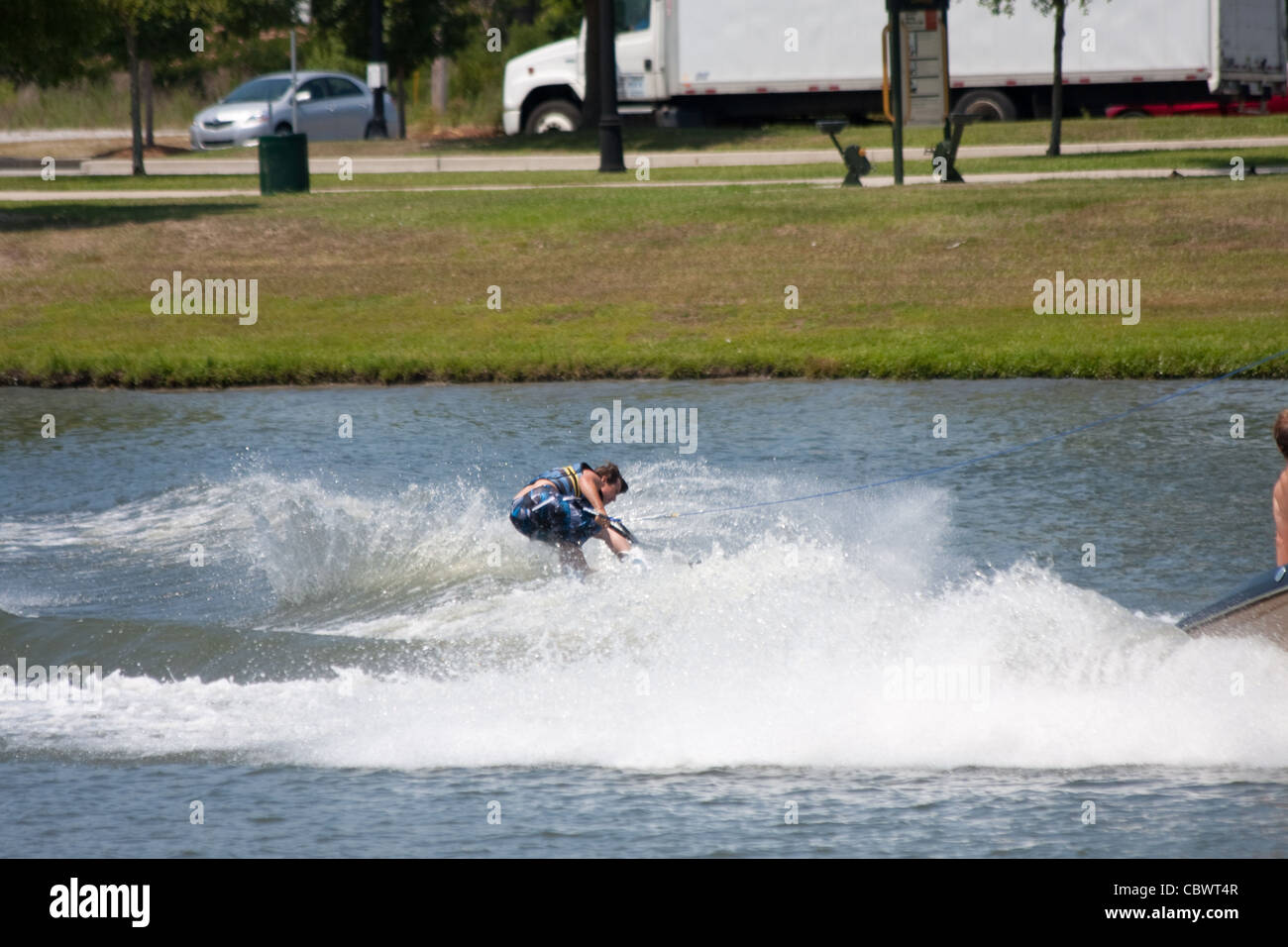 Man jumping the wake, stunts on a wakeboard, extreme sport Stock Photo ...