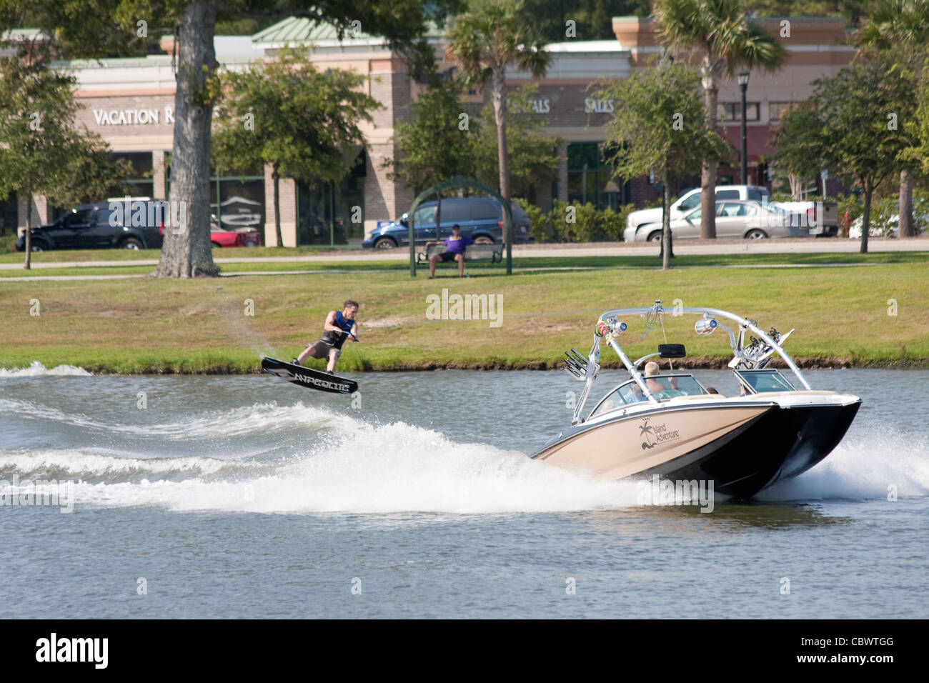 Man jumping the wake, stunts on a wakeboard, extreme sport Stock Photo ...