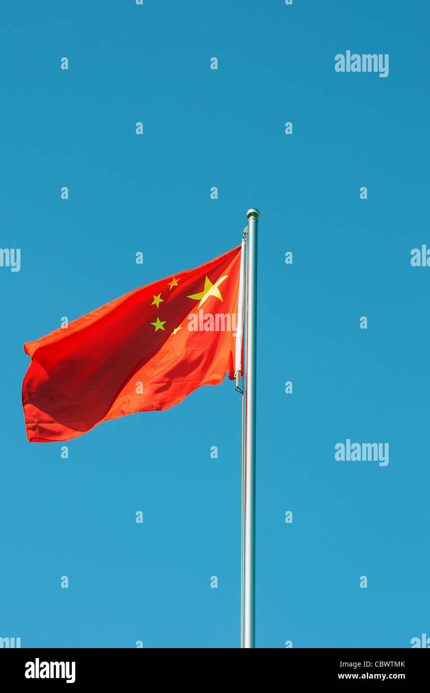 Chinese national five-star red flag fluttering in the wind against blue ...