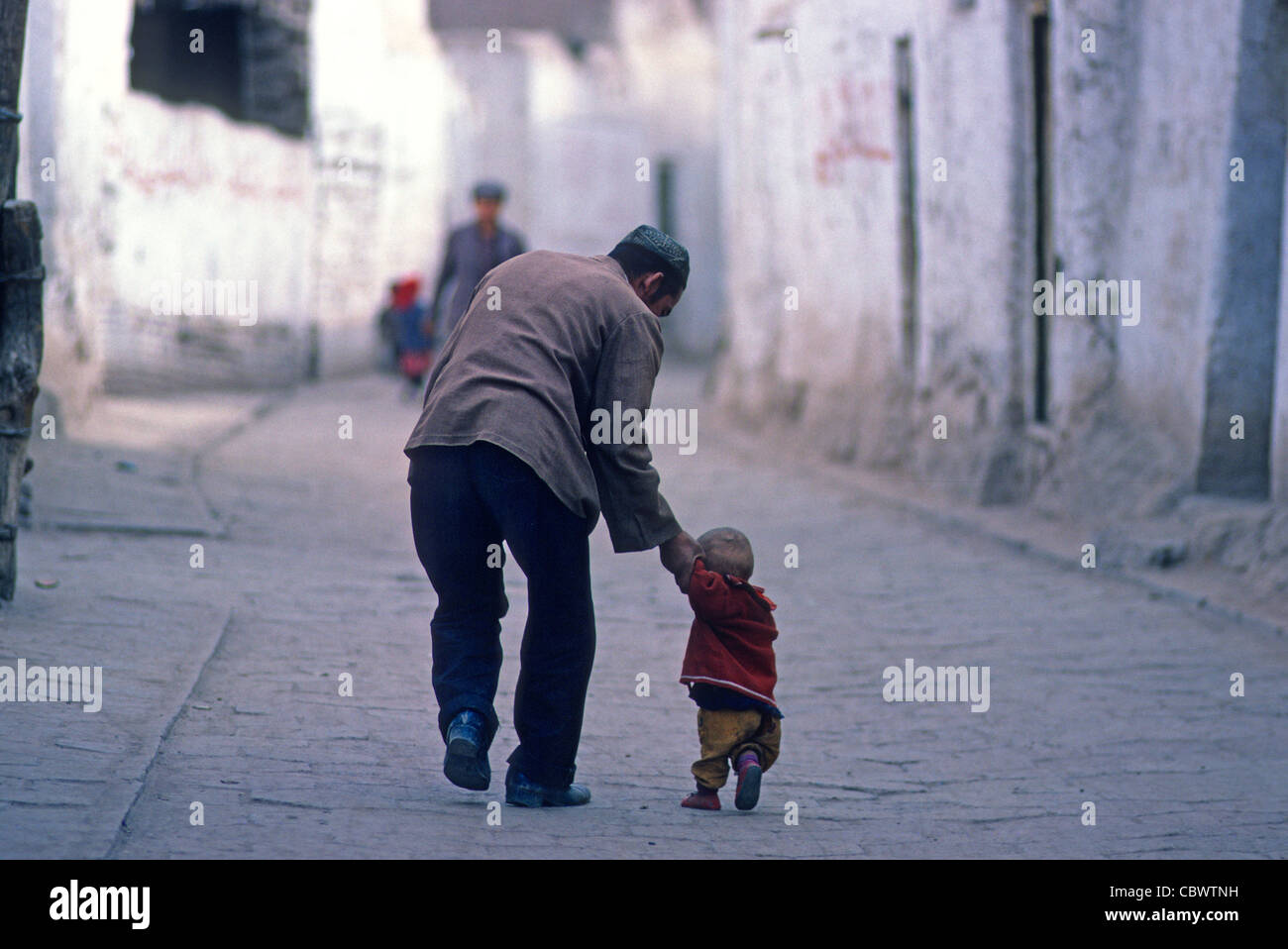 Old man walking small child hi-res stock photography and images - Alamy