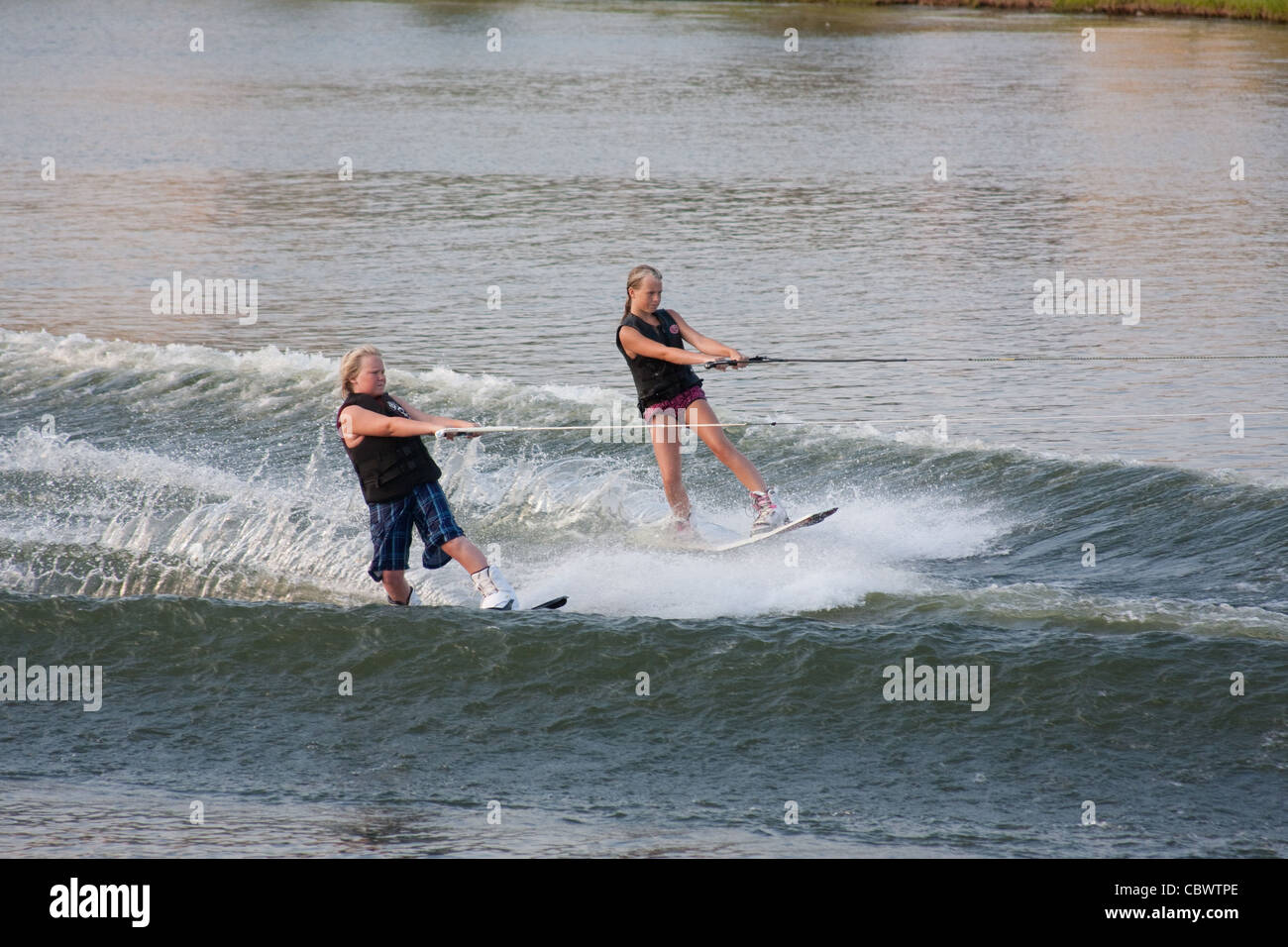 Young Boy And Girl Wake Boarding Stock Photo - Alamy