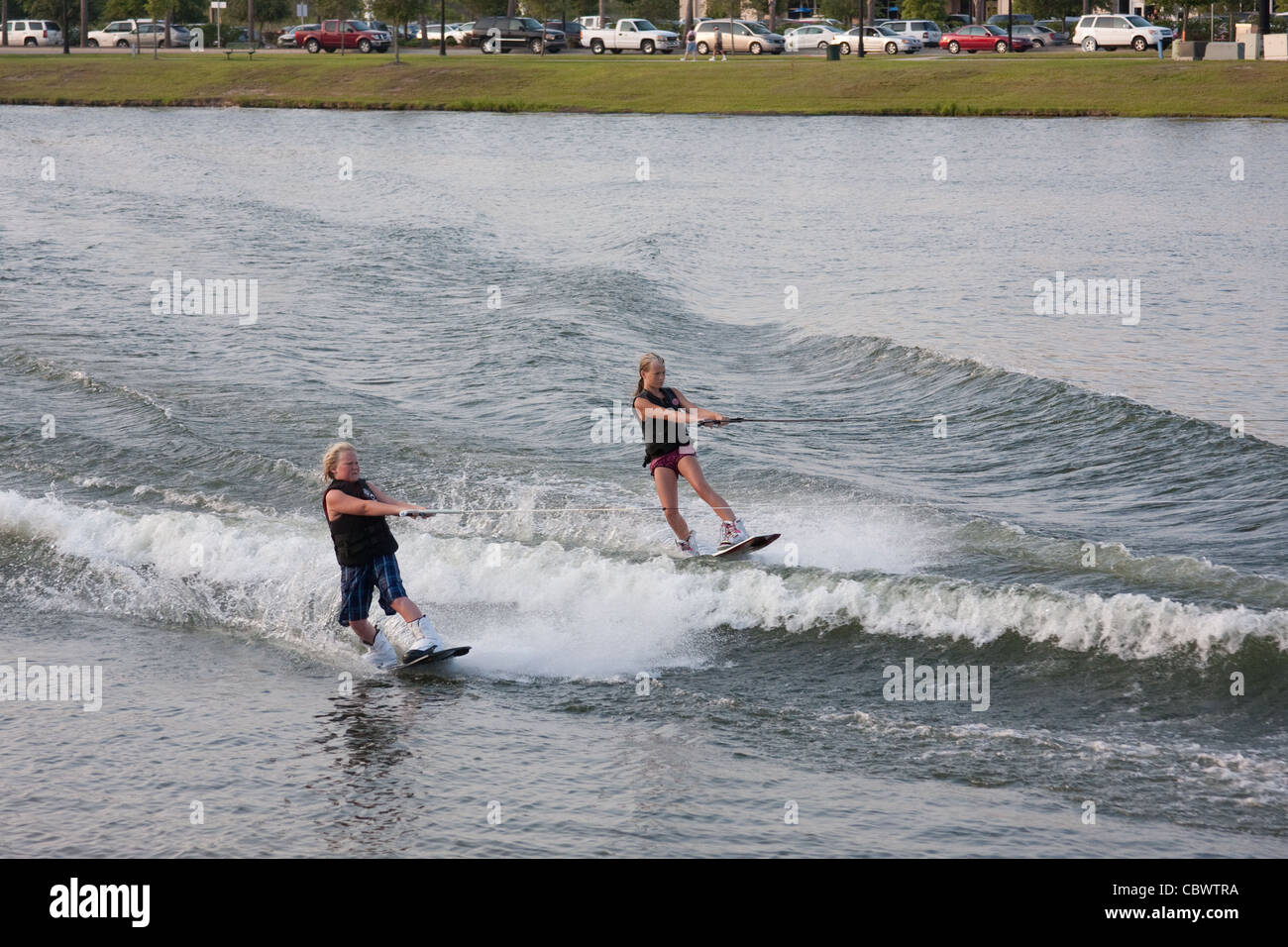 Young Boy And Girl Wake Boarding Stock Photo - Alamy