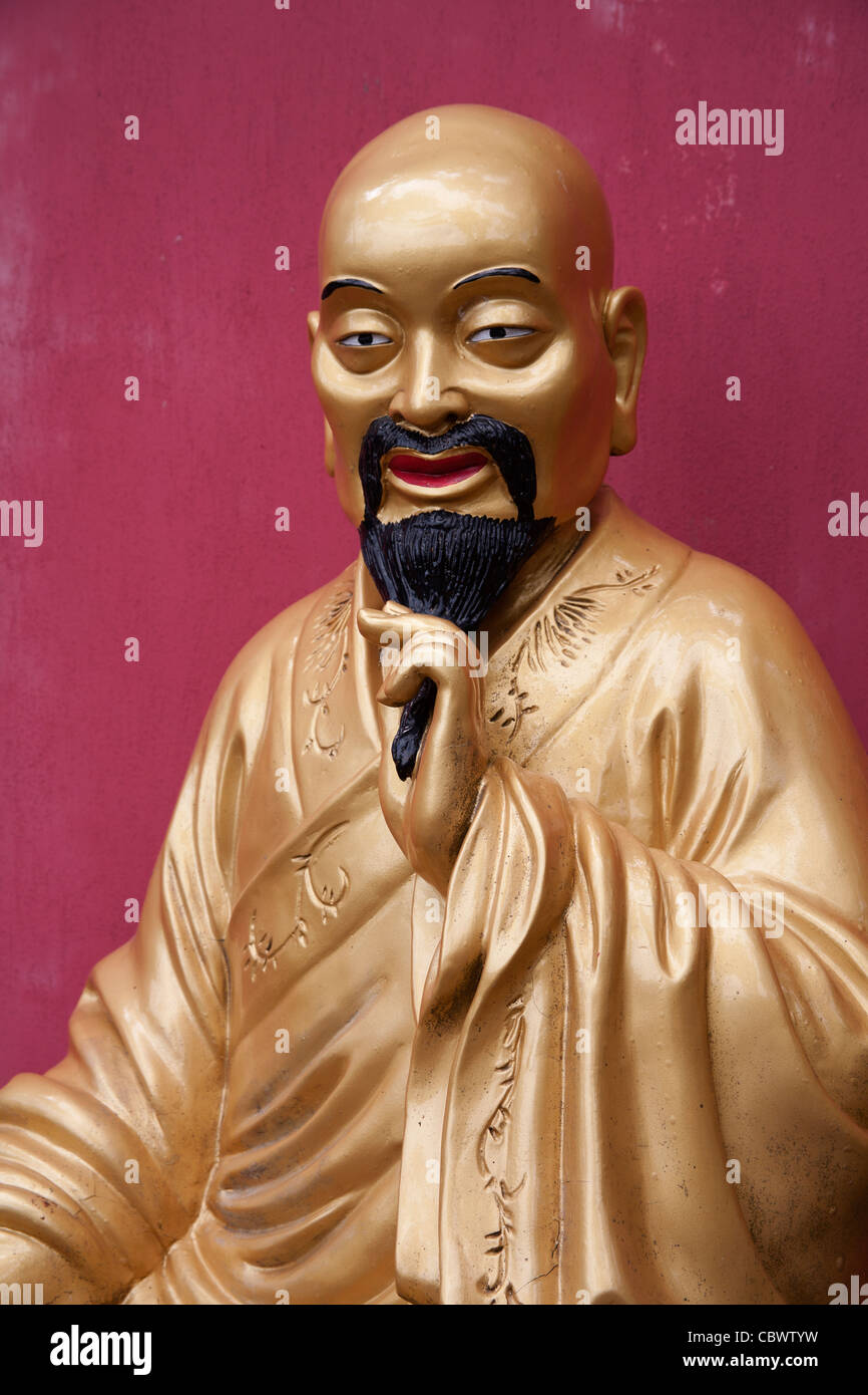 Gold painted Buddha stroking beard Ten Thousand Buddhas Monastery - Man ...