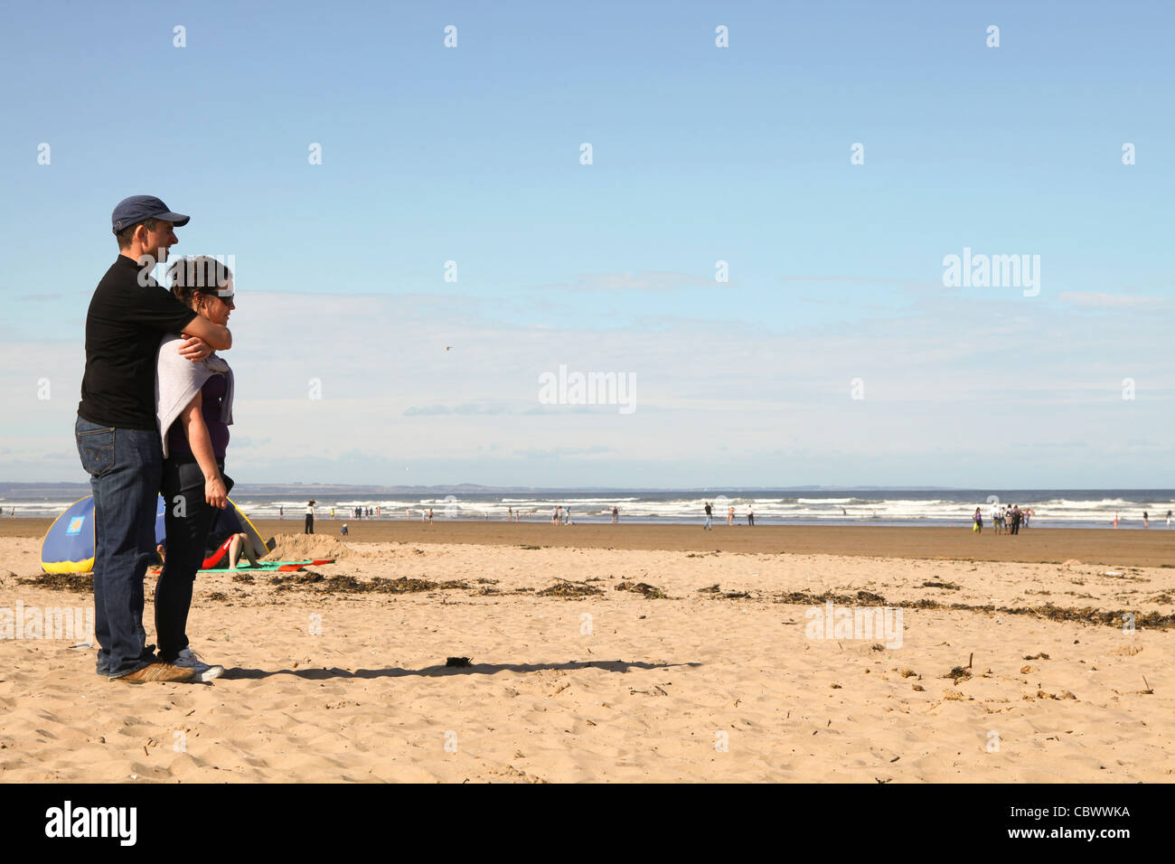 Man woman standing fully clothed hi-res stock photography and images - Alamy