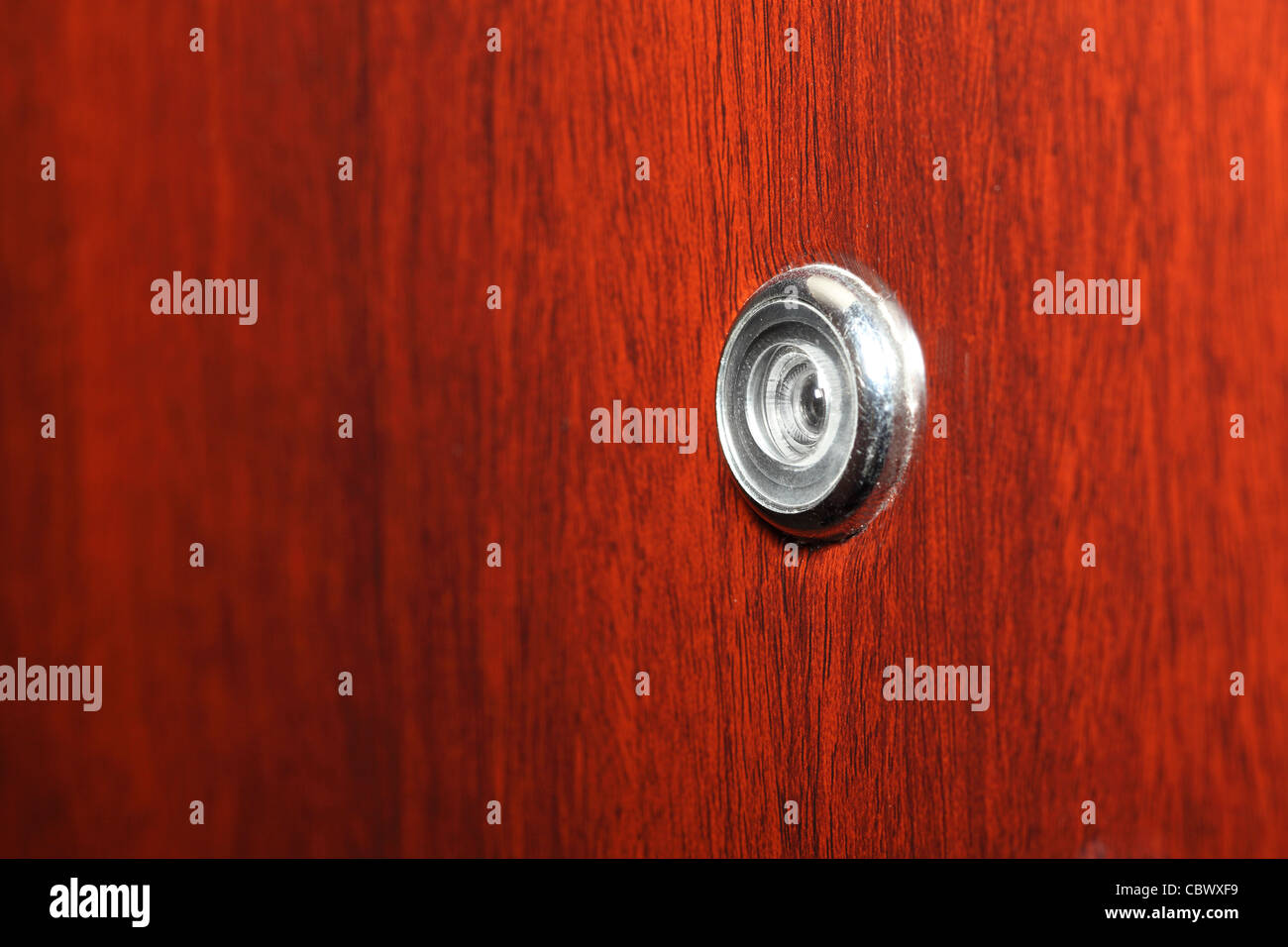 Peephole on wooden door - judas hole spyhole Stock Photo - Alamy