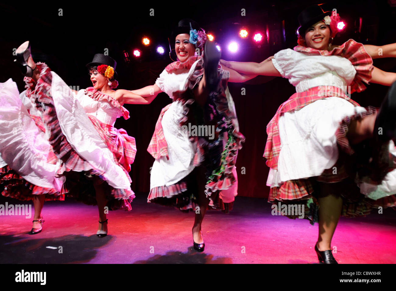 An dancer goes through her routine during the opening night of the 8th ...