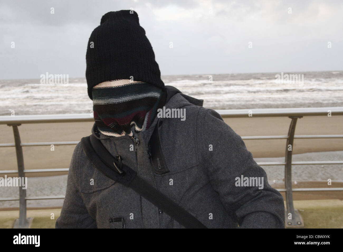 man wrapped up warm against cold Blackpool, Lancashire, England, UK ...