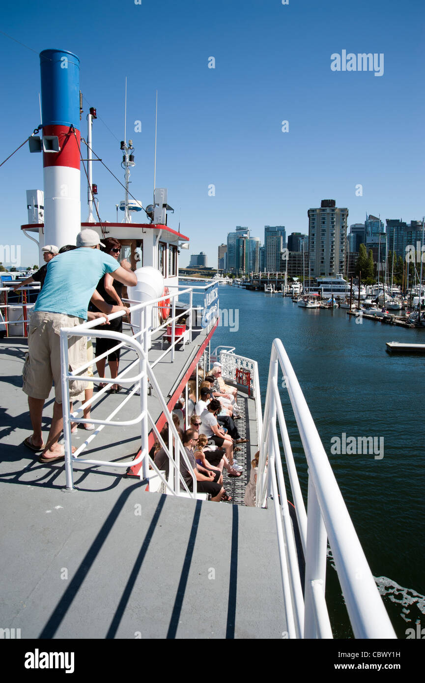 Tourists on a boat tour of Vancouver Canada's downtown waterfront Stock ...
