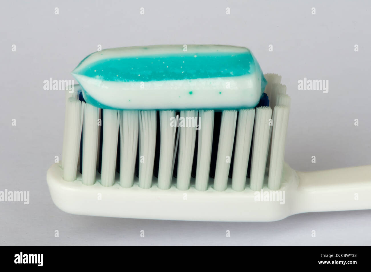 Toothbrush and toothpaste on top. Very close up Stock Photo - Alamy