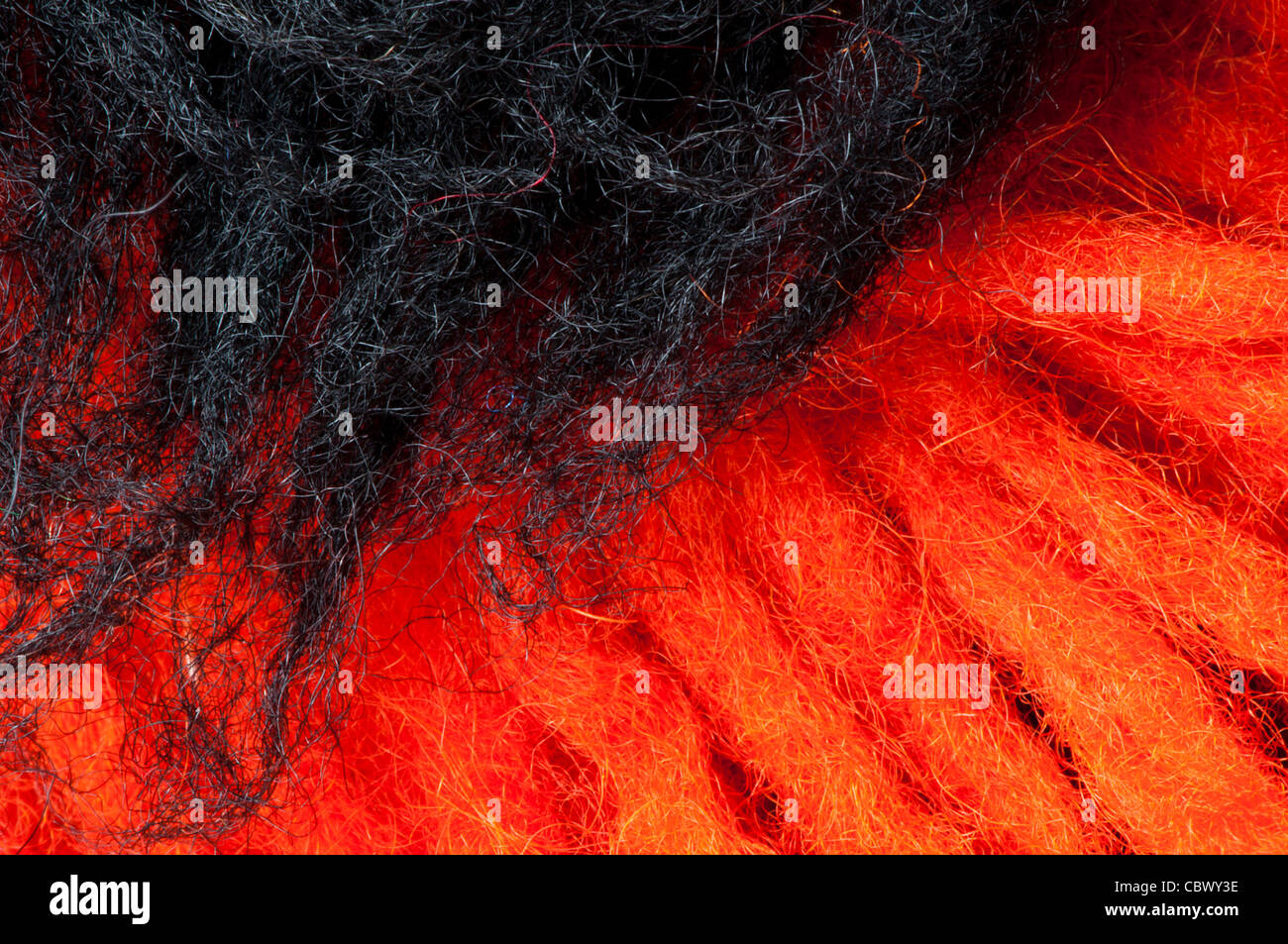 Black and red wool fibers closeup Stock Photo - Alamy