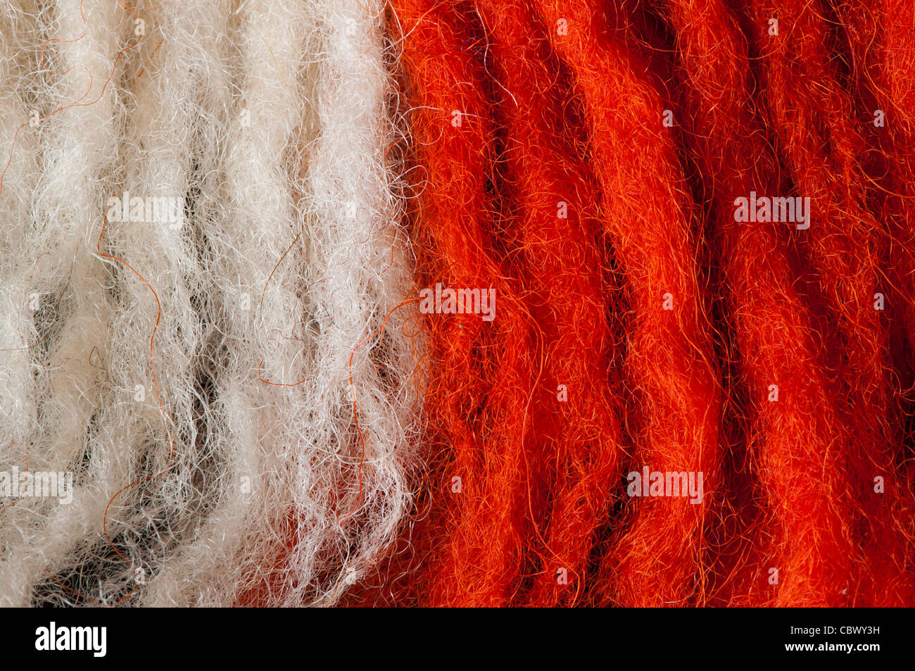 White and red wool fibers closeup Stock Photo - Alamy