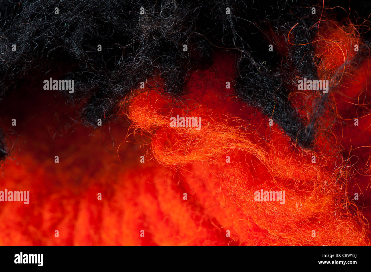 Black and red wool fibers closeup Stock Photo - Alamy
